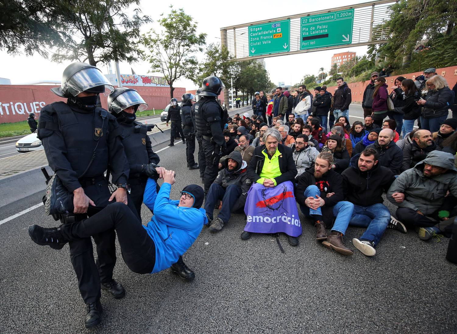 In Photos: Protesters block roads and trains across Catalonia - The ...